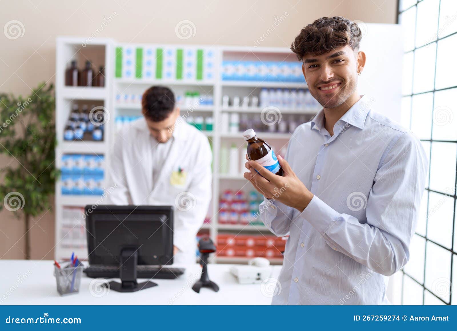 Two Hispanic Men Pharmacist and Client Using Computer Reading ...