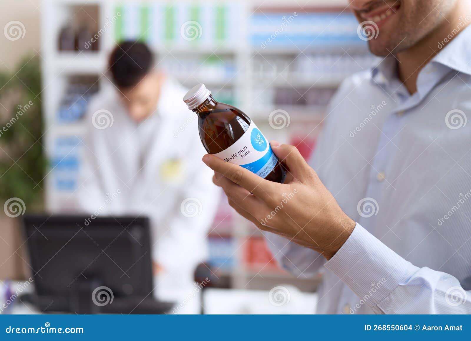 Two Hispanic Men Pharmacist and Client Using Computer Reading ...
