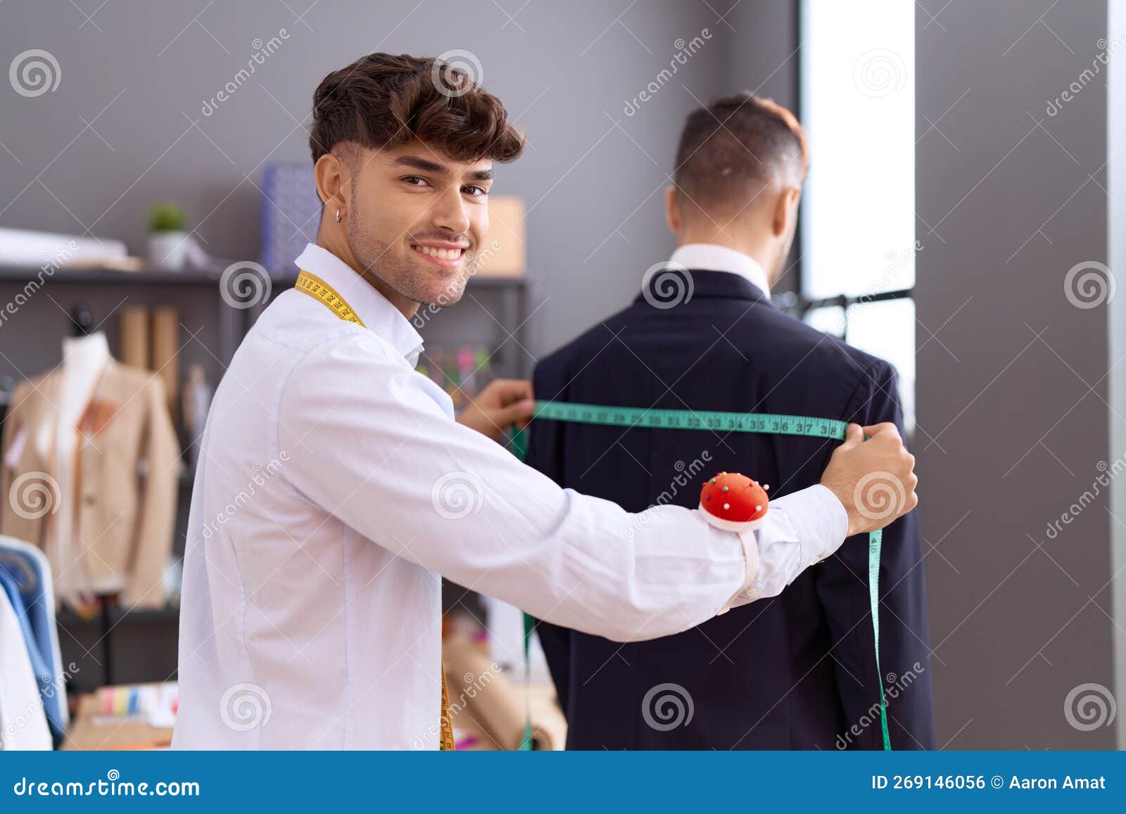 Two Hispanic Men Tailor Measuring Back Client at Atelier Stock Photo ...