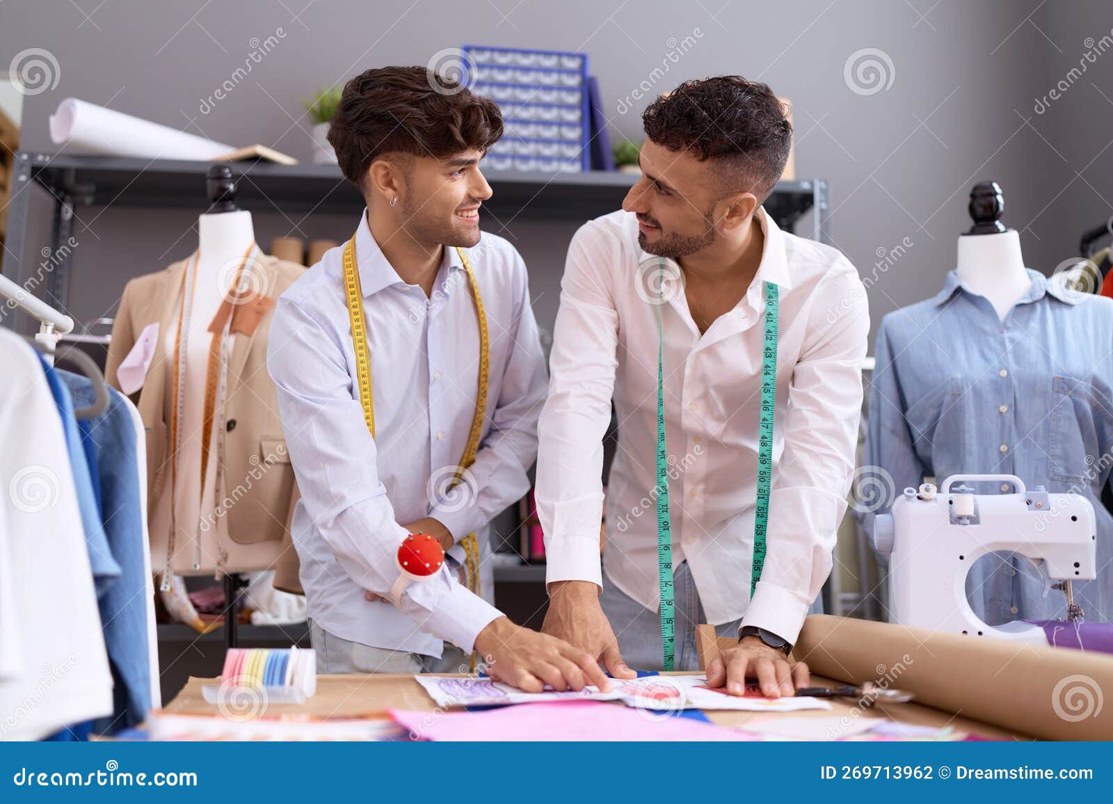 Two Hispanic Men Tailors Looking Clothing Design Speaking at Atelier ...