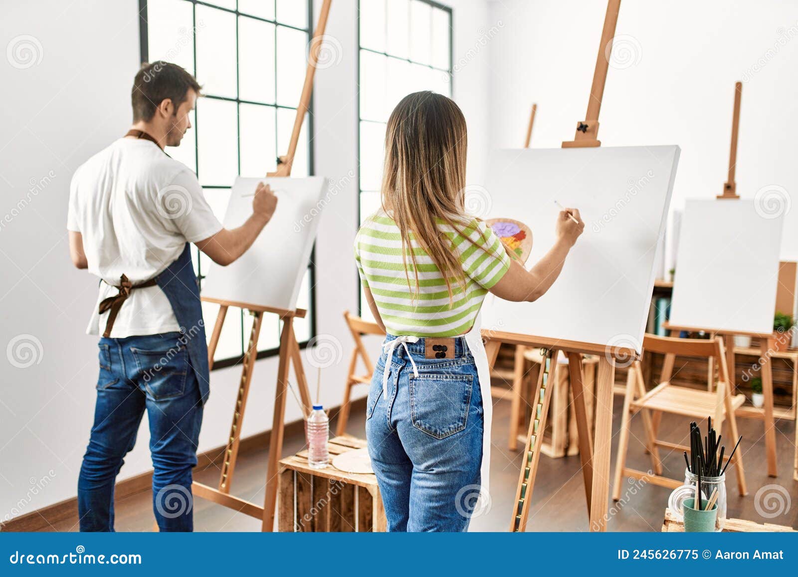 Two Hispanic Students on Back View Painting at Art Studio Stock Image ...