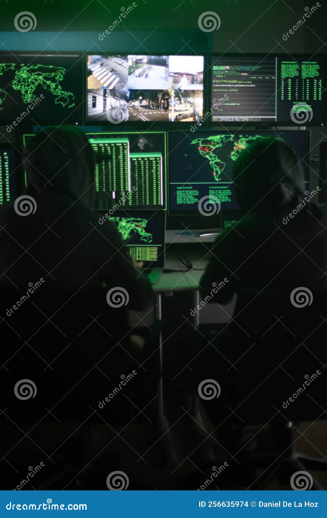 Two Hooded Hackers Hacking Security Firewall Late at Night in Basement ...