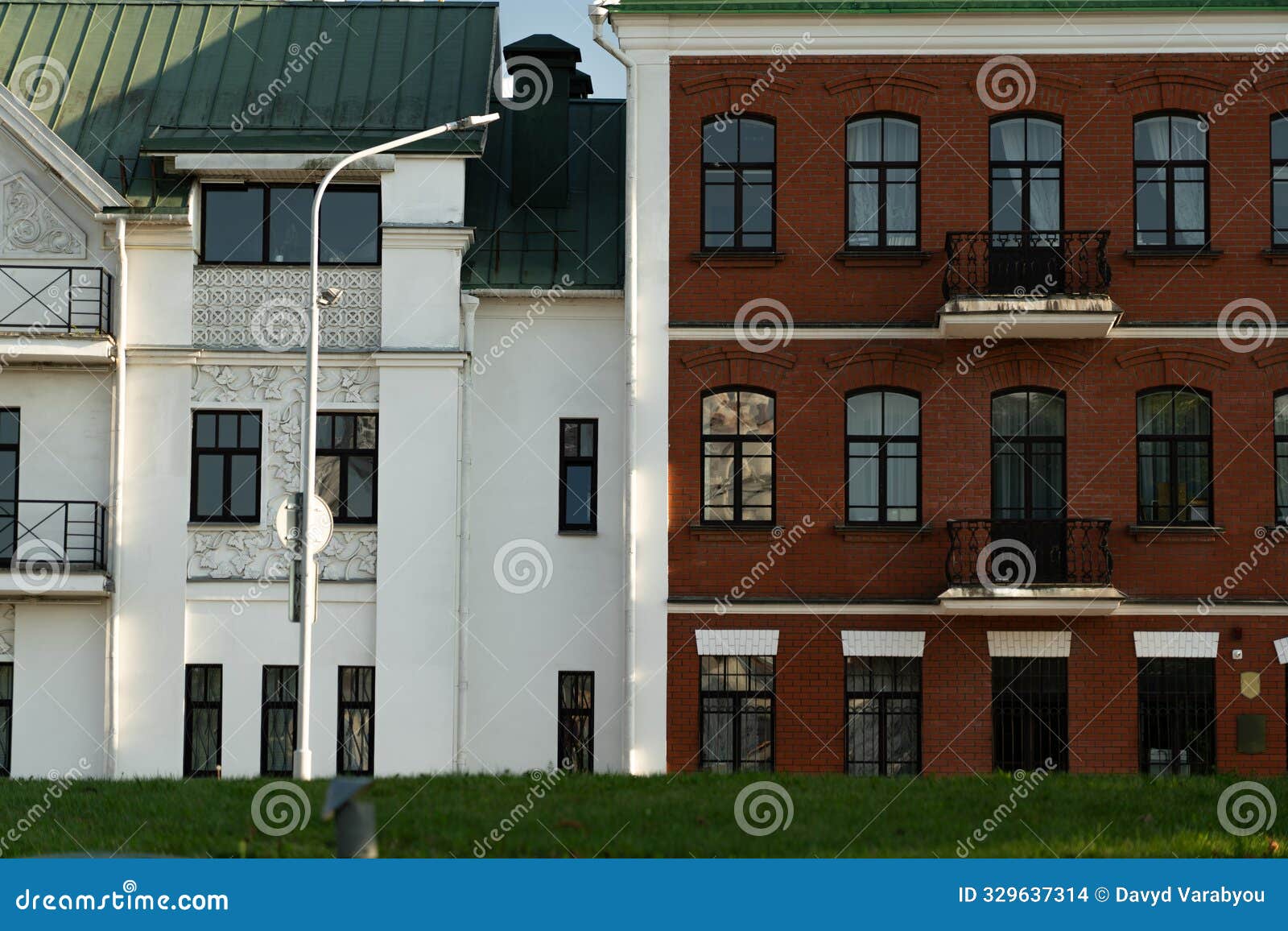 Two Houses Standing Side by Side in Different Styles of Construction ...