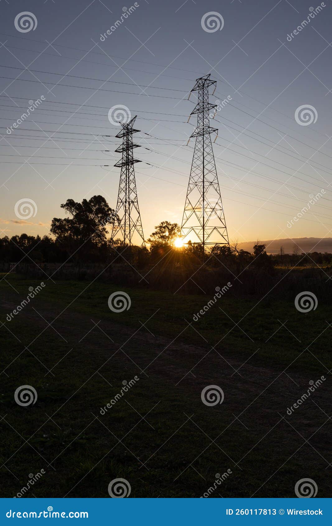 Huge Power Towers on a Field during Sunset Stock Image - Image of road ...