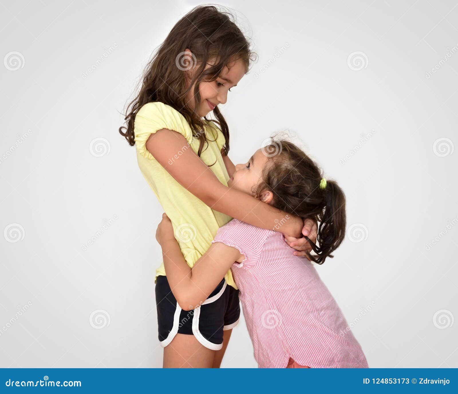Two Hugging Sisters Looking at Each Other Stock Image - Image of love ...