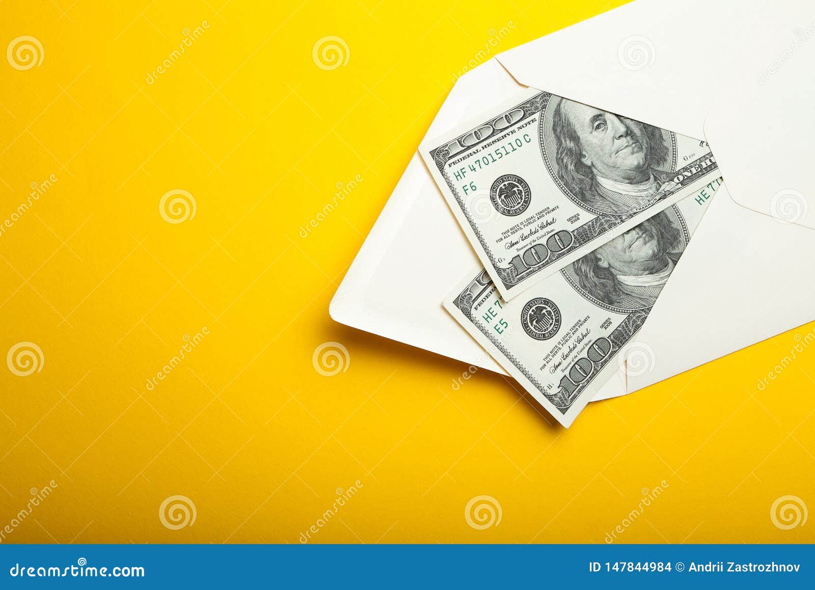 Two Hundred Dollar Bills in an Envelope Isolated on a Yellow Background ...