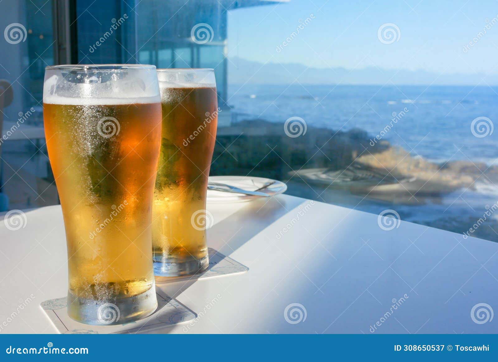 Two Ice Cold Beers on a Table Outdoors at Sun Down Stock Image - Image ...