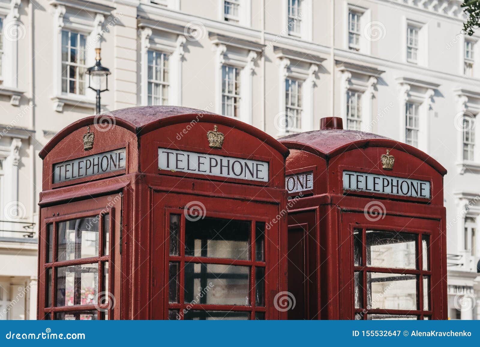 Two Iconic British Red Telephone Boxes Against Buildings, Selective ...