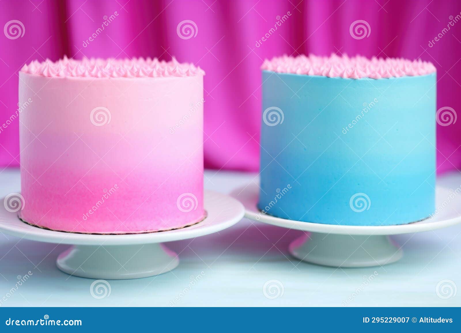 Two Identical Cakes, One in Pink Icing, One in Blue Stock Image - Image ...