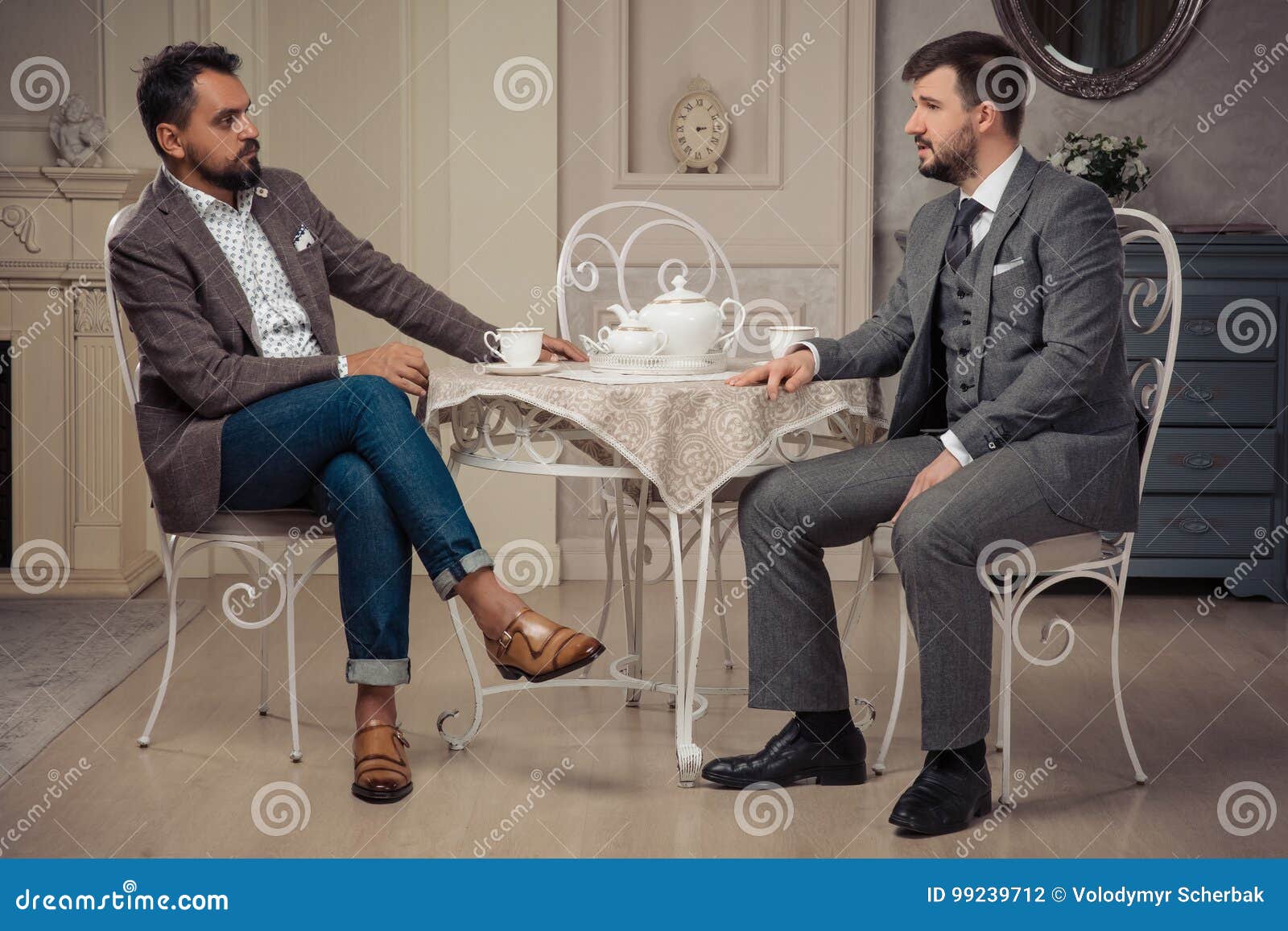 Two Imposimg Men Conversing at the Table Stock Photo - Image of ...