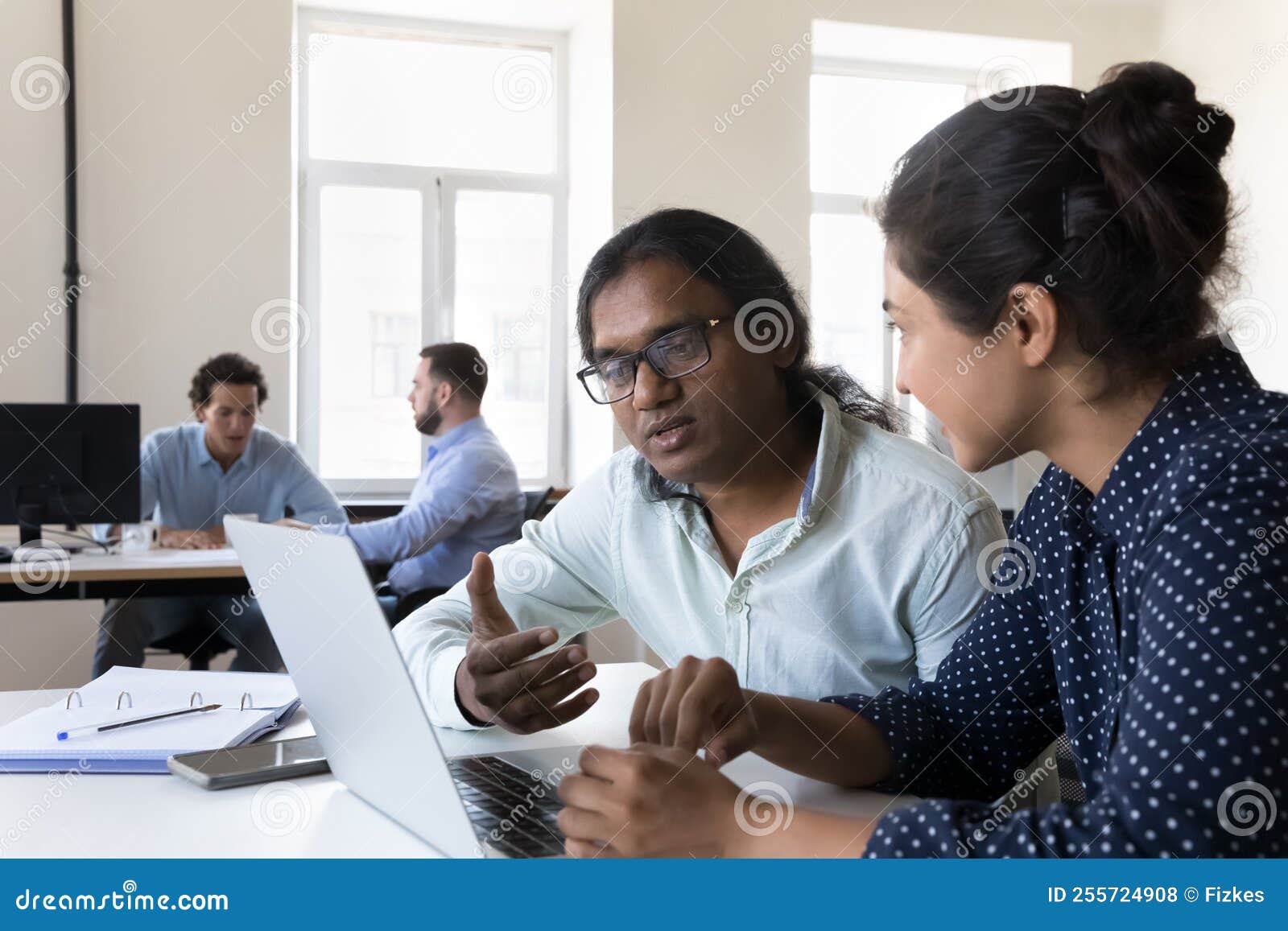 Two Indian Employees Collaborating on Project, Sitting at Work Table ...
