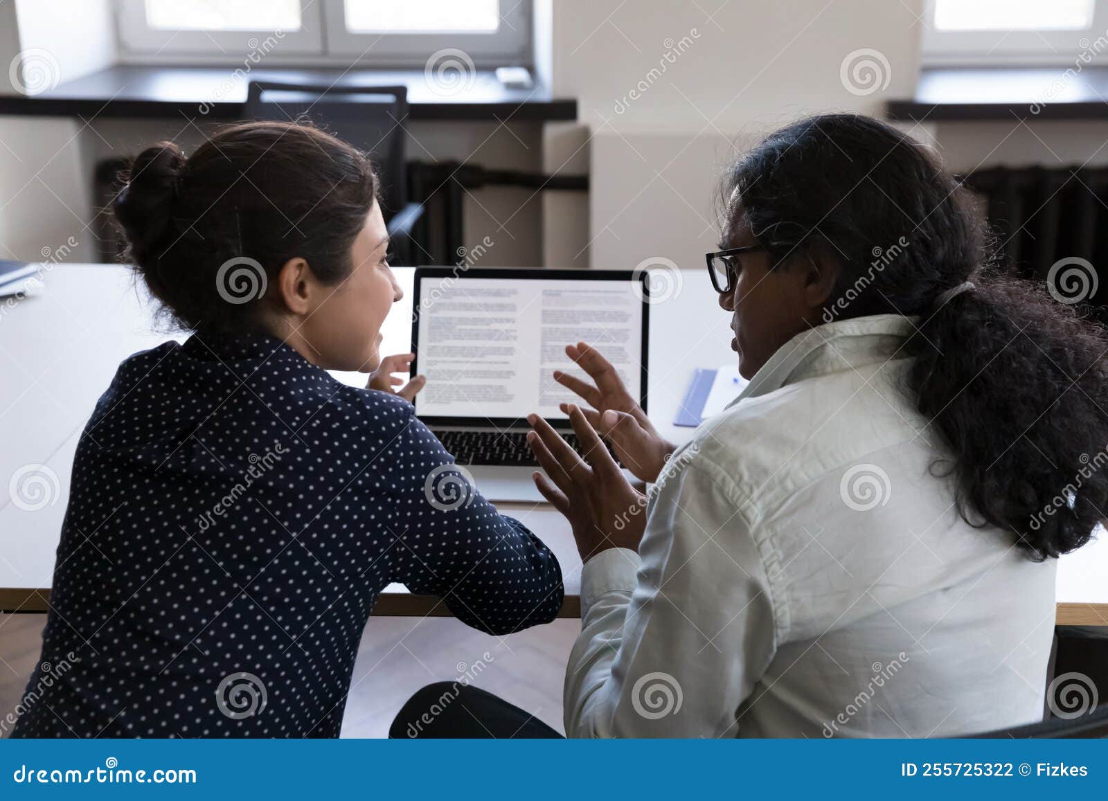 Two Indian Office Employees Sharing Laptop at Work Table Stock Photo ...