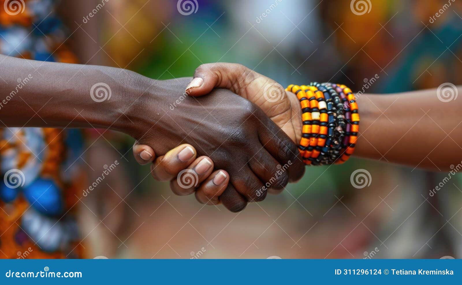 Two Individuals from Different Cultures Warmly Shaking Hands, with a ...