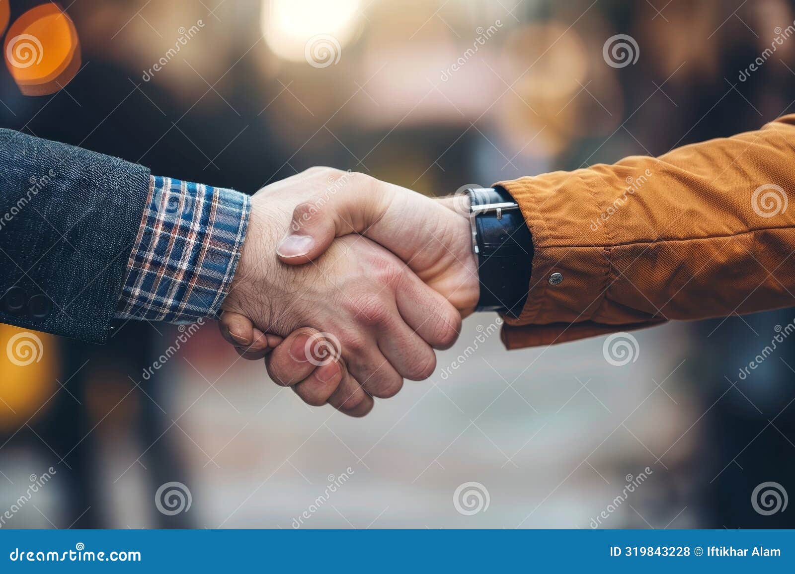 Two Individuals Performing a Handshake Gesture with a City Backdrop ...