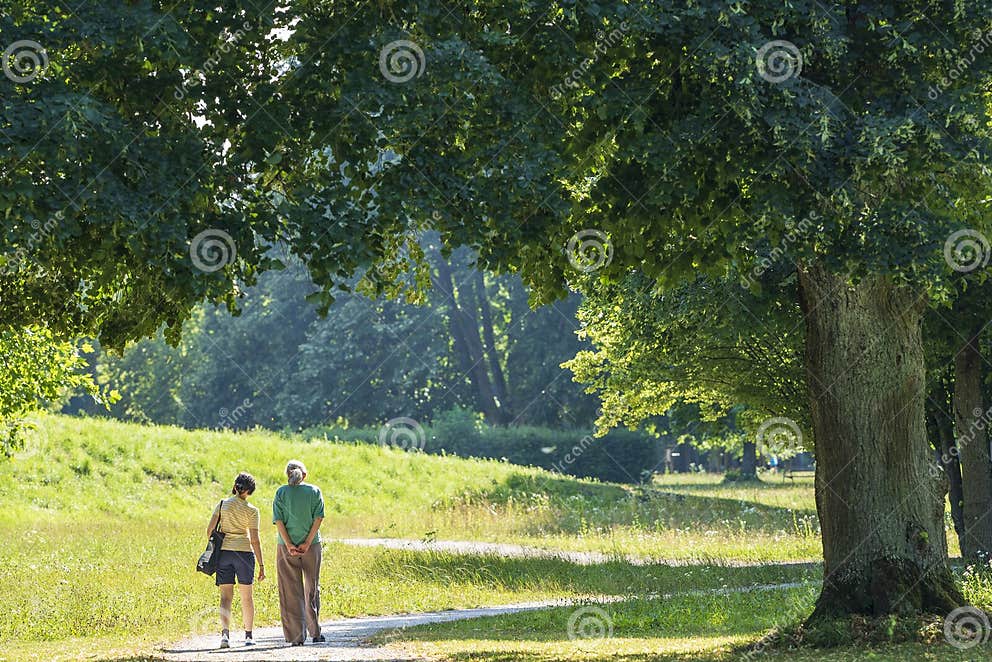 The Two People are Walking Down the Path Together Together, Stock Image ...