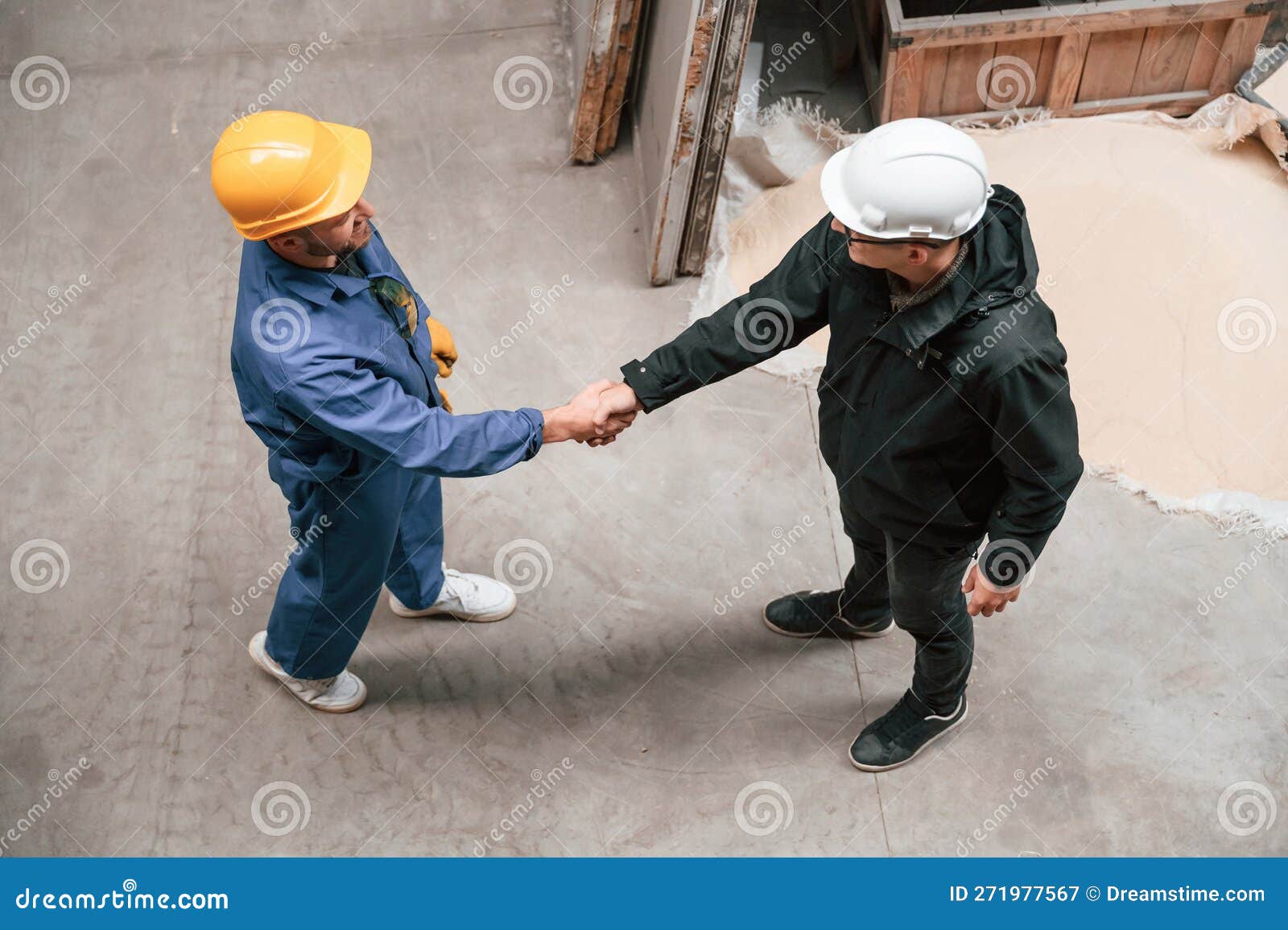 Two Industrial Workers are Doing Handshake. Top View Stock Image ...
