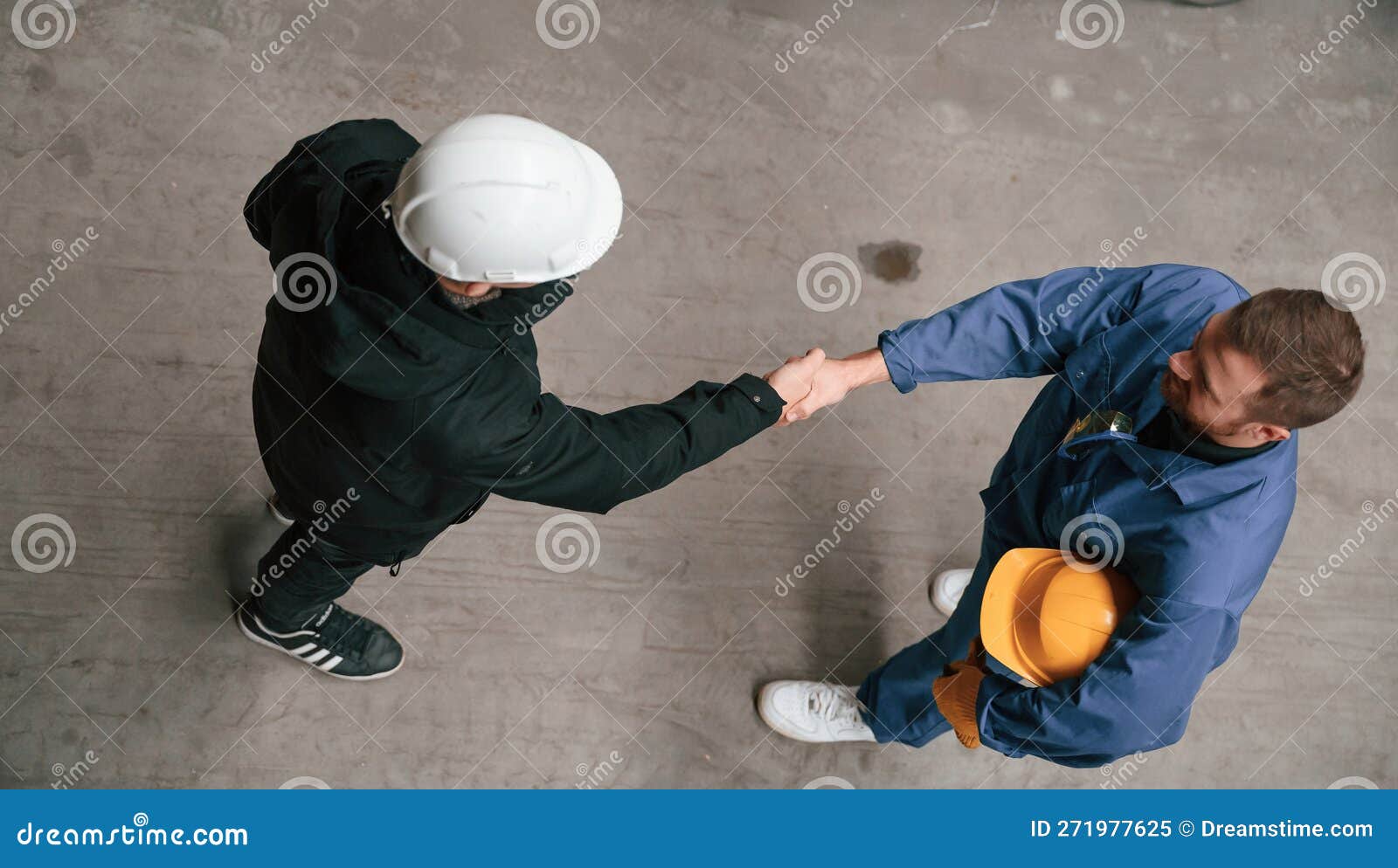 Two Industrial Workers are Doing Handshake. Top View Stock Image ...