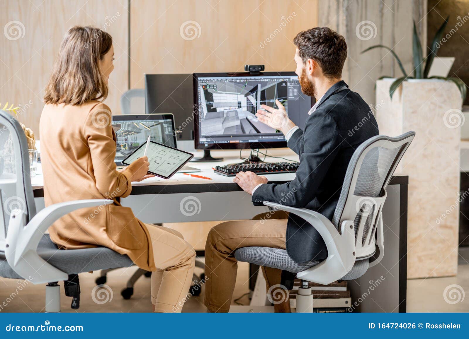 Interior Designers At Work In Office