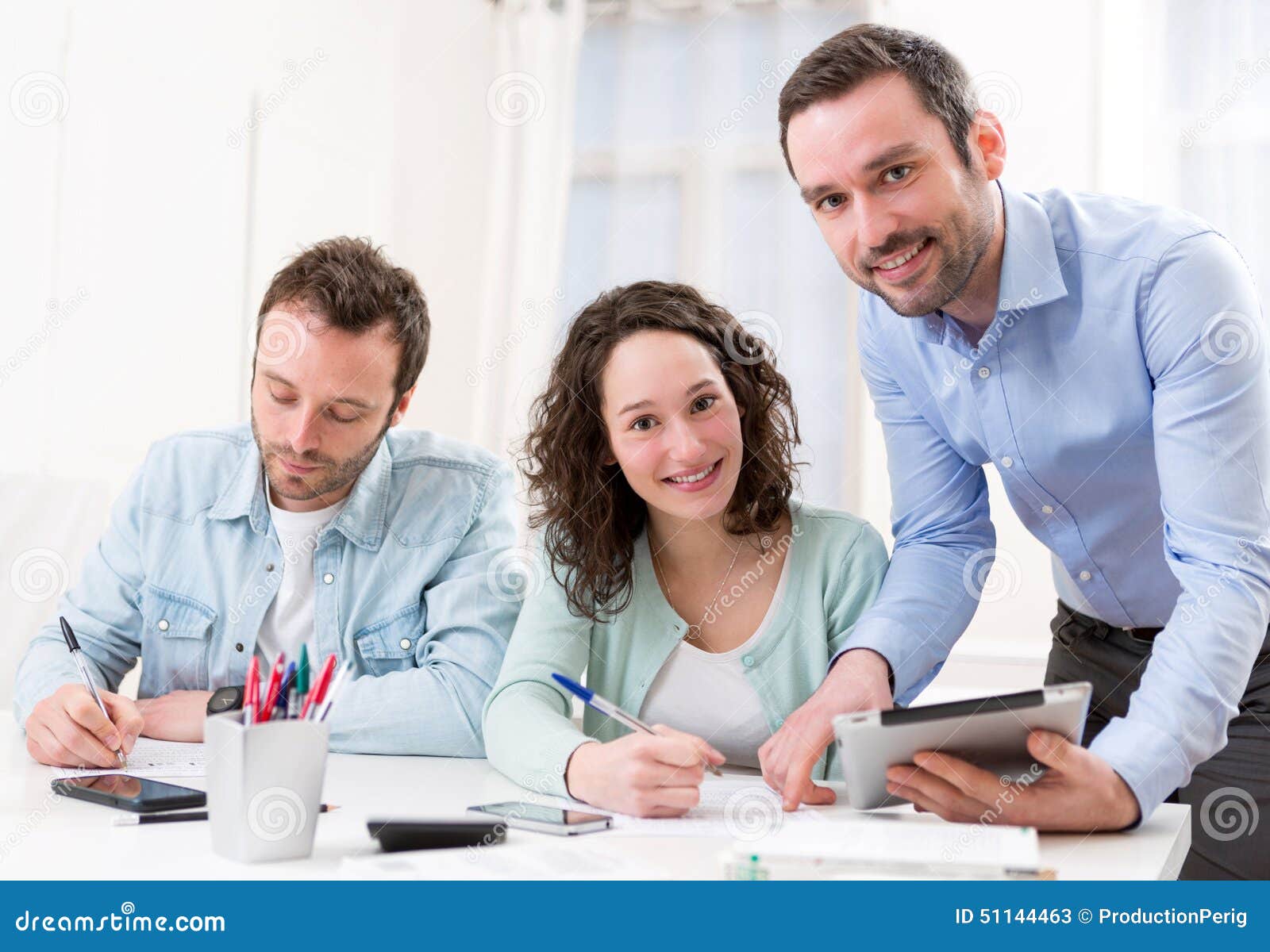 Two Interns Working Together Assisted by Their Course Supervisor Stock ...