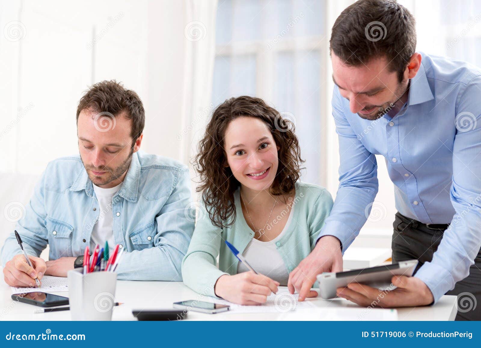 Two Interns Working Together Assisted by Their Course Supervisor Stock ...