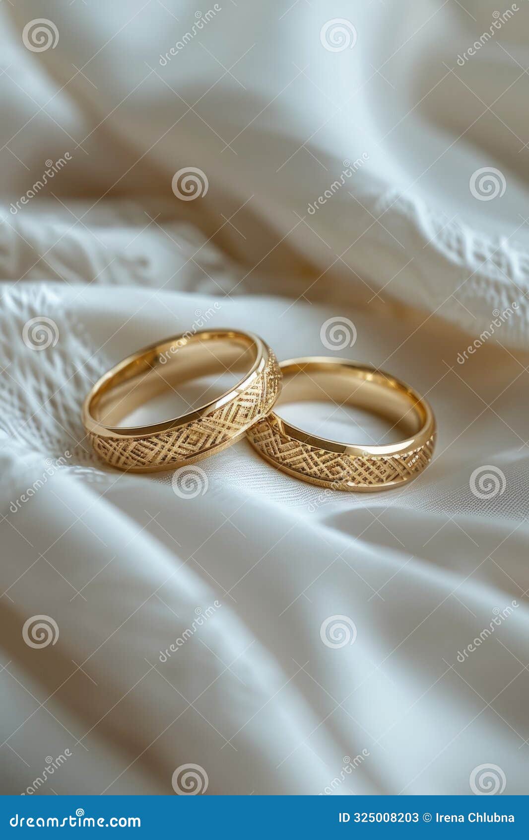Two Intricately Designed Gold Wedding Rings on Satin Fabric Stock ...