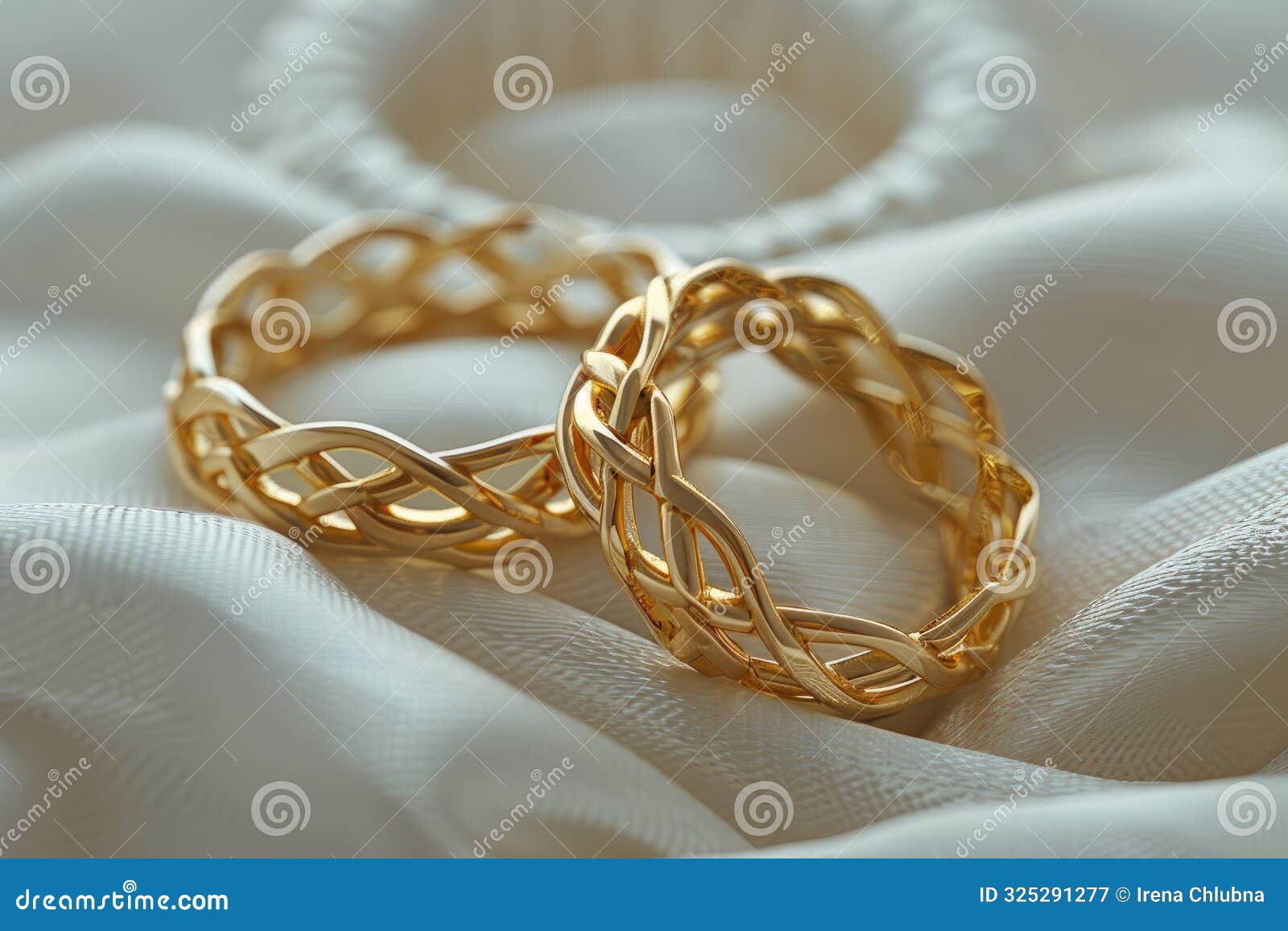 Two Intricately Designed Gold Wedding Rings on Satin Fabric Stock ...