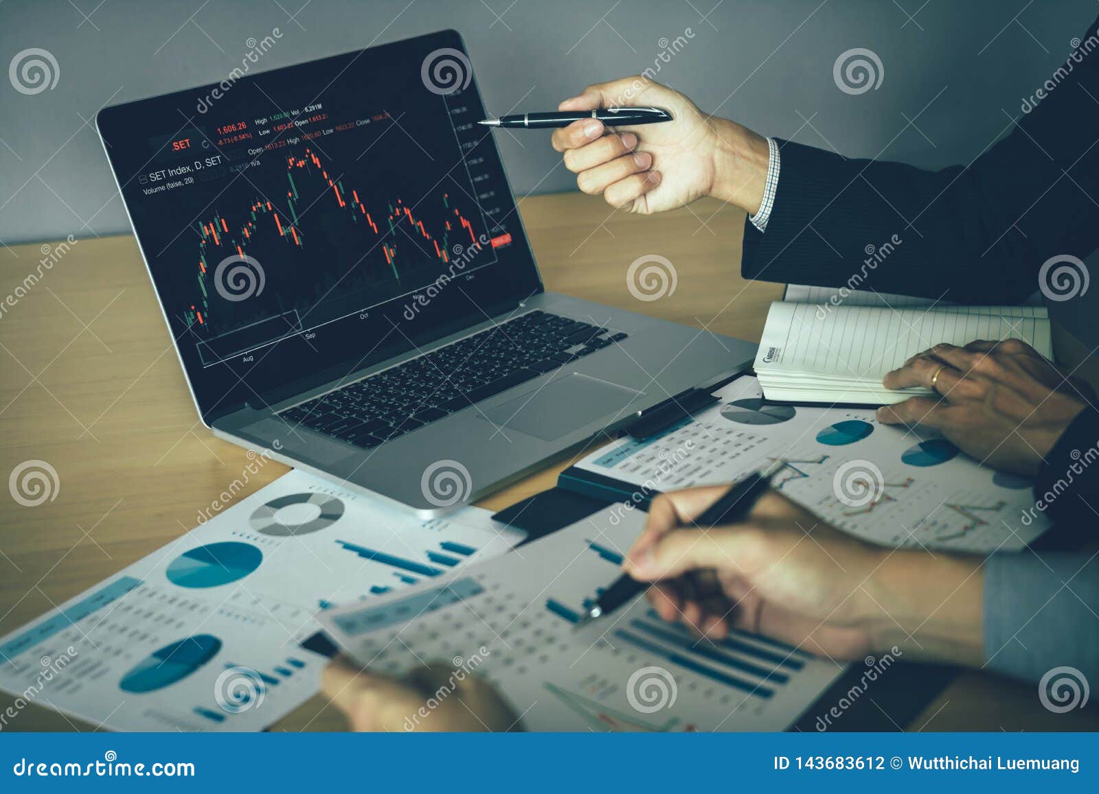 Two Investors Working Together are Analyzing the Stock Chart on the ...