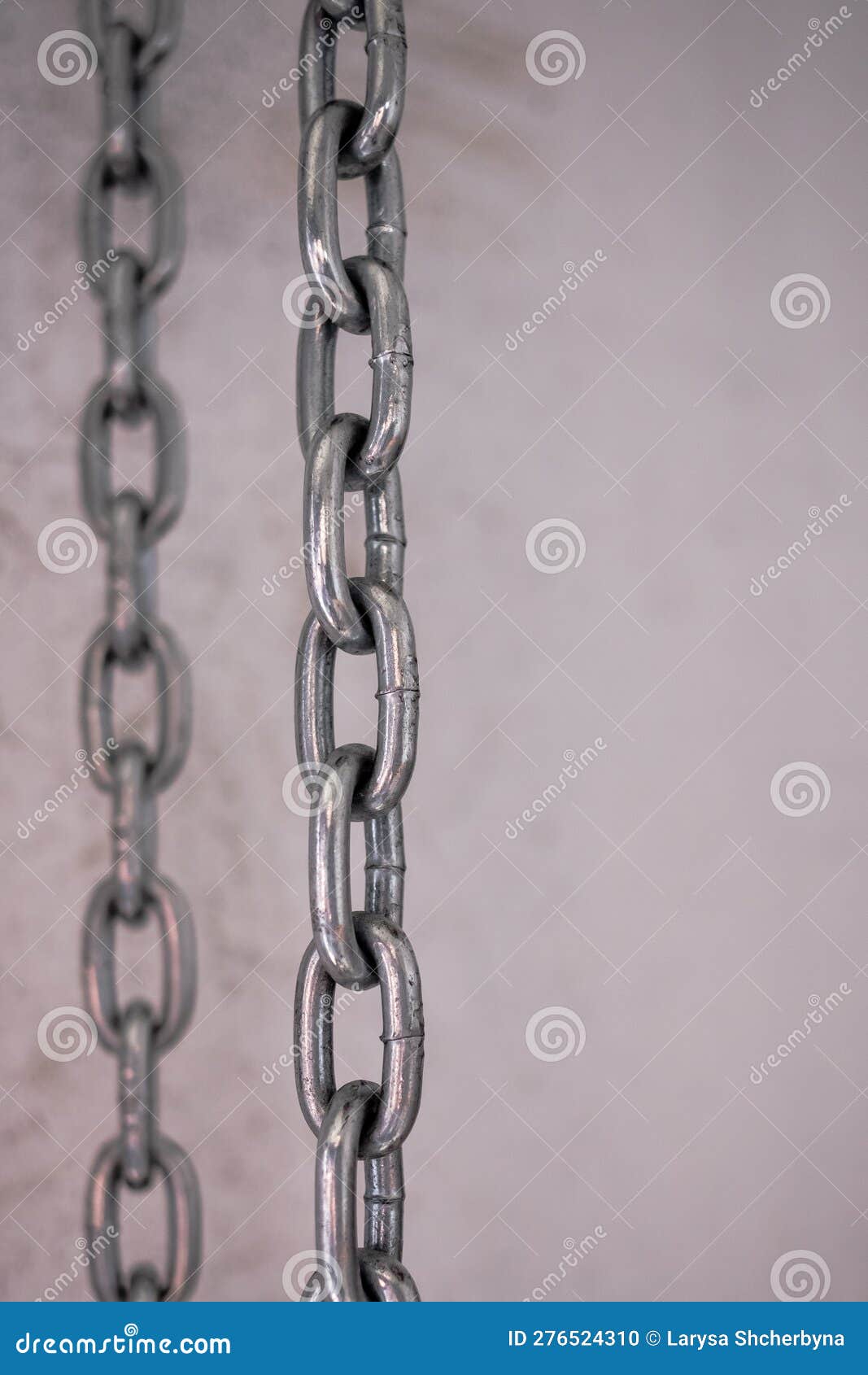 Two Iron Chains Hang Vertically on a Light Background Stock Photo ...