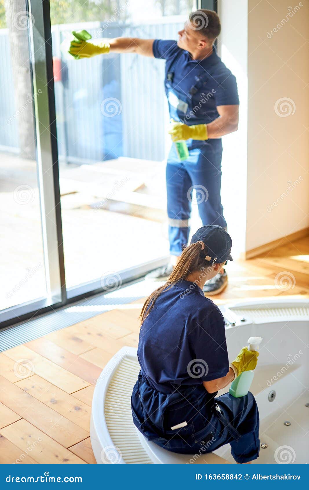 Two Janitors Cleaning Bathroom Stock Photo - Image of hygiene, cleaner ...