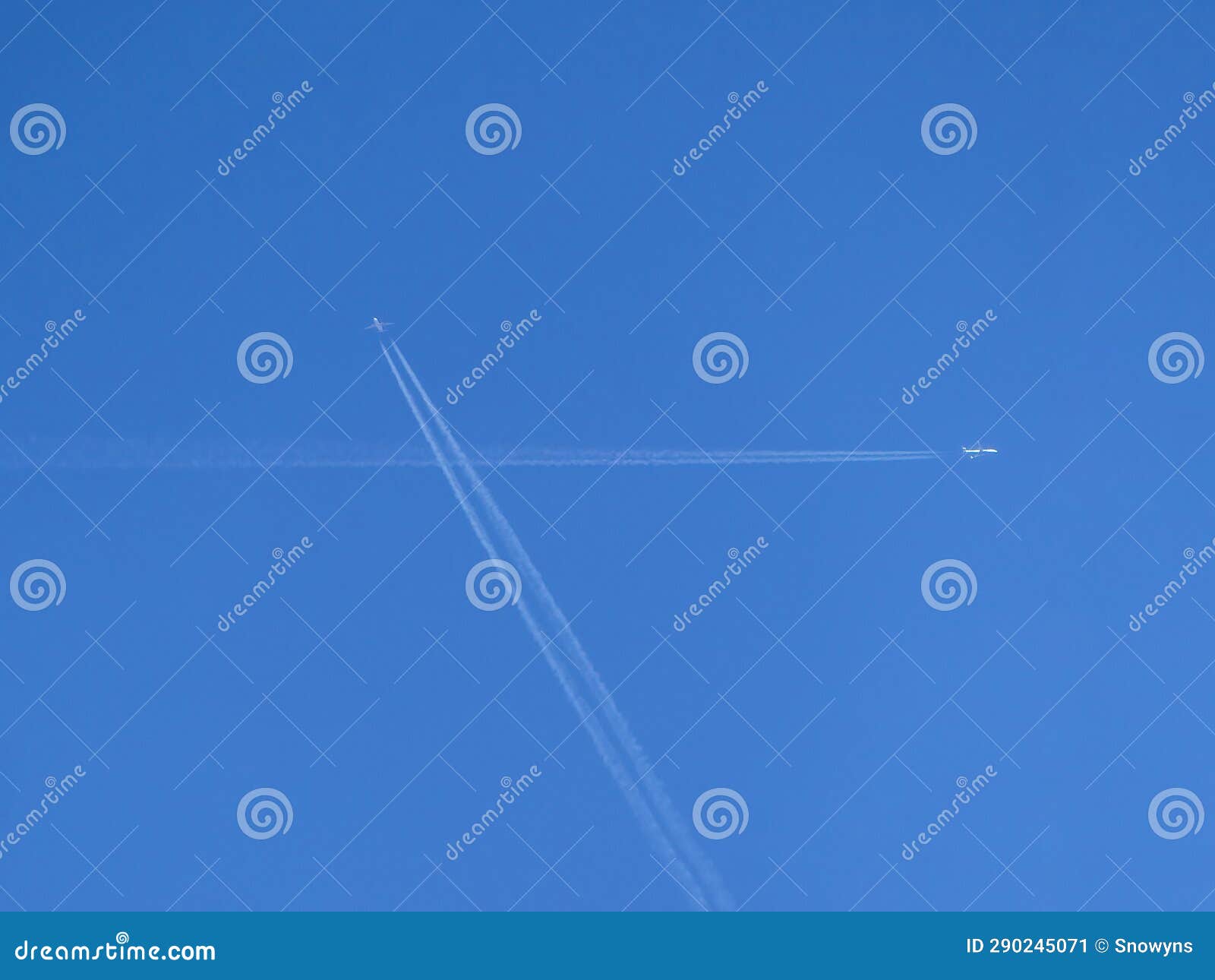 Two Jet Planes at High Altitude with a Passing Vapor Trail Stock Image ...