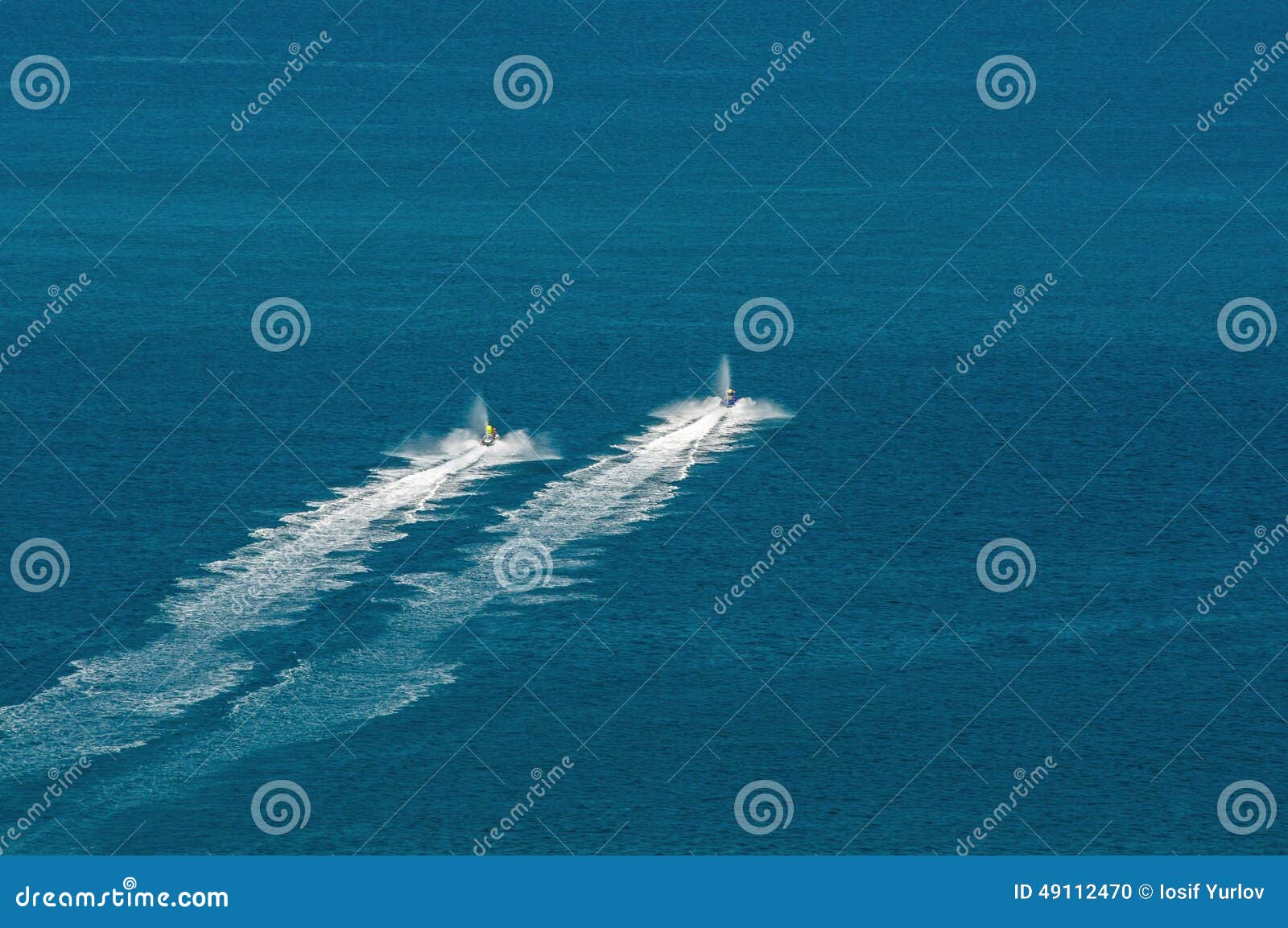 Two jet-skies riding stock photo. Image of holiday, overcast - 49112470