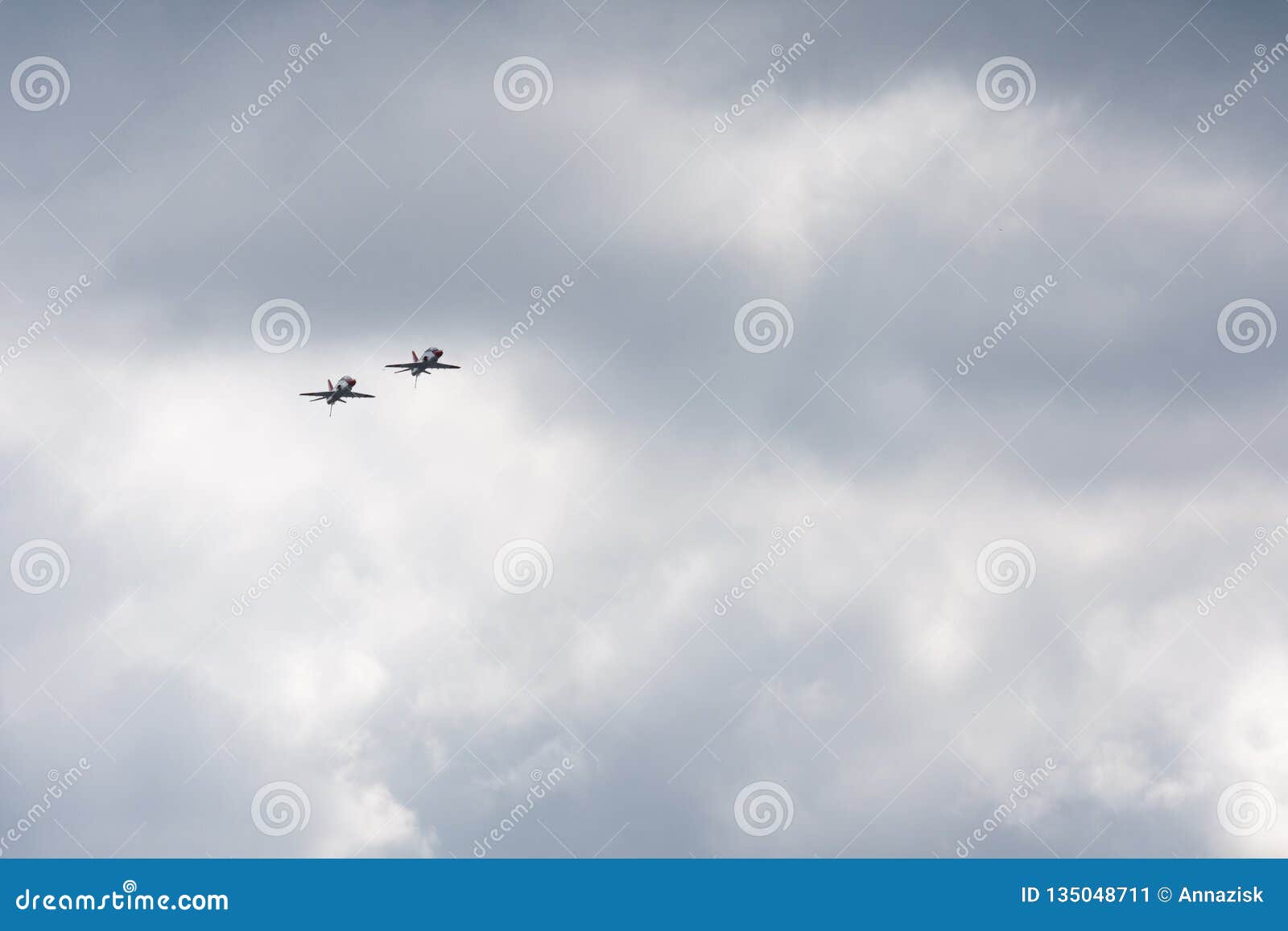 Two jets flying in clouds stock image. Image of airplane - 135048711