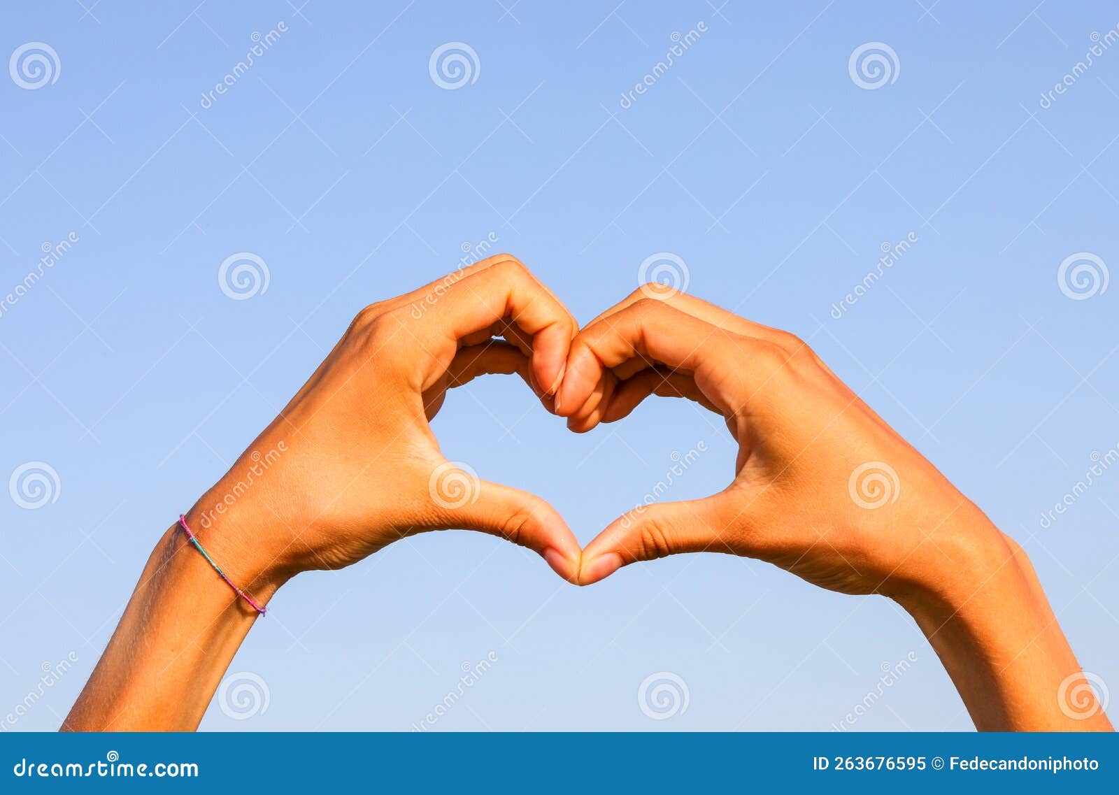 Two Joined Hands Forming the Shape of a Heart and the Blue Sky Stock ...