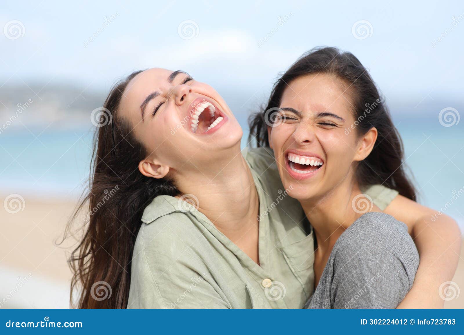 Two Joyful Friends Laughing Hilariously on the Beach Stock Photo ...
