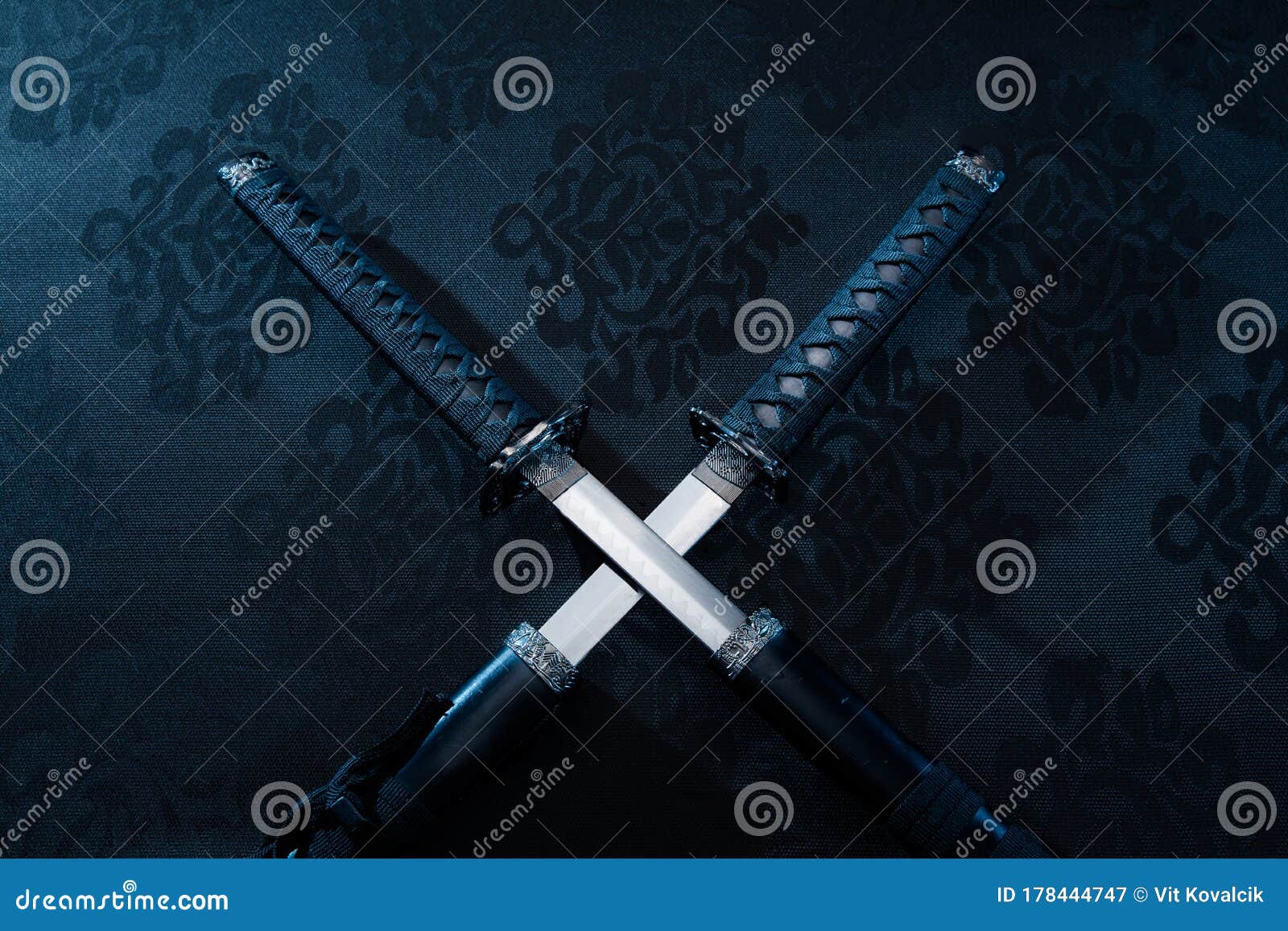 Two Katanas with Partially Drawn Blades on Fabric Stock Image - Image ...