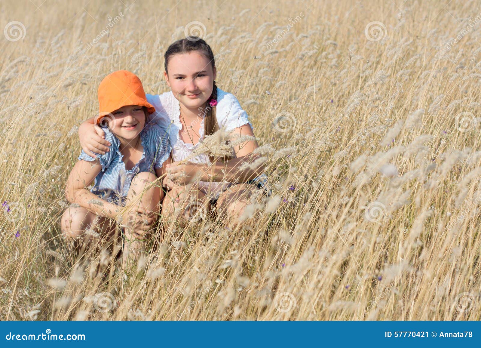 Two kid girls on the field stock image. Image of friend - 57770421