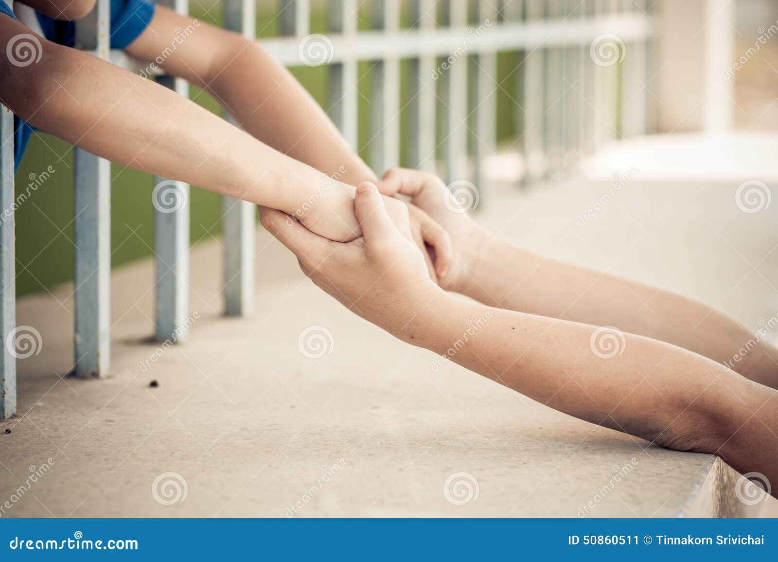 Two kid hand hold together stock image. Image of iron - 50860511
