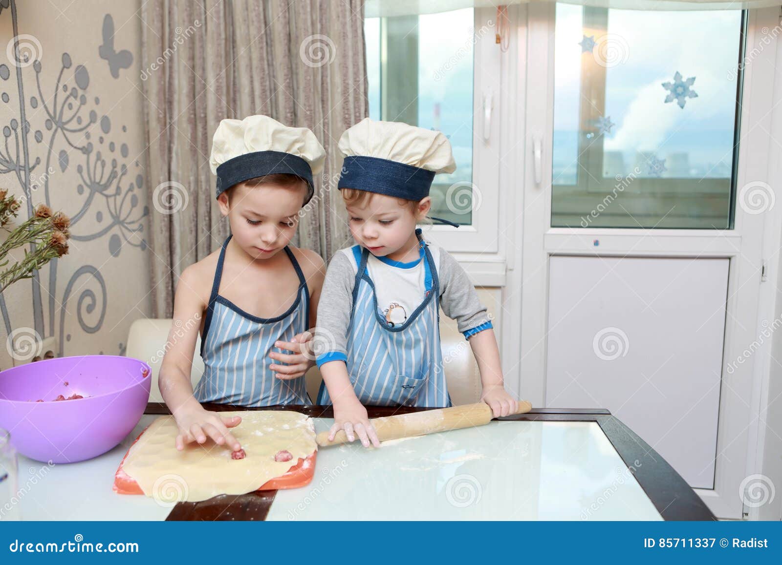 Two Kids Cooking dumplings stock image. Image of caucasian - 85711337