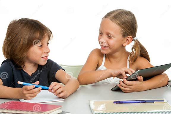 Two Kids Discussing Homework at Desk. Stock Image - Image of holding ...
