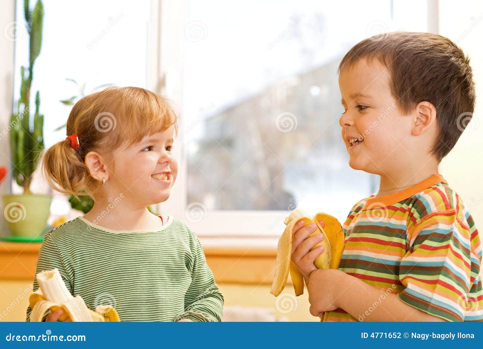 Two kids eating bananas stock photo. Image of girl, enjoy - 4771652