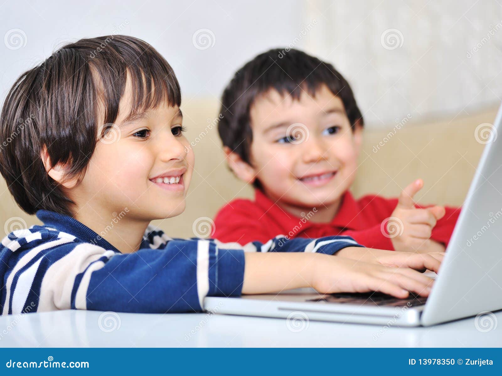 Two kids with laptop stock photo. Image of education - 13978350