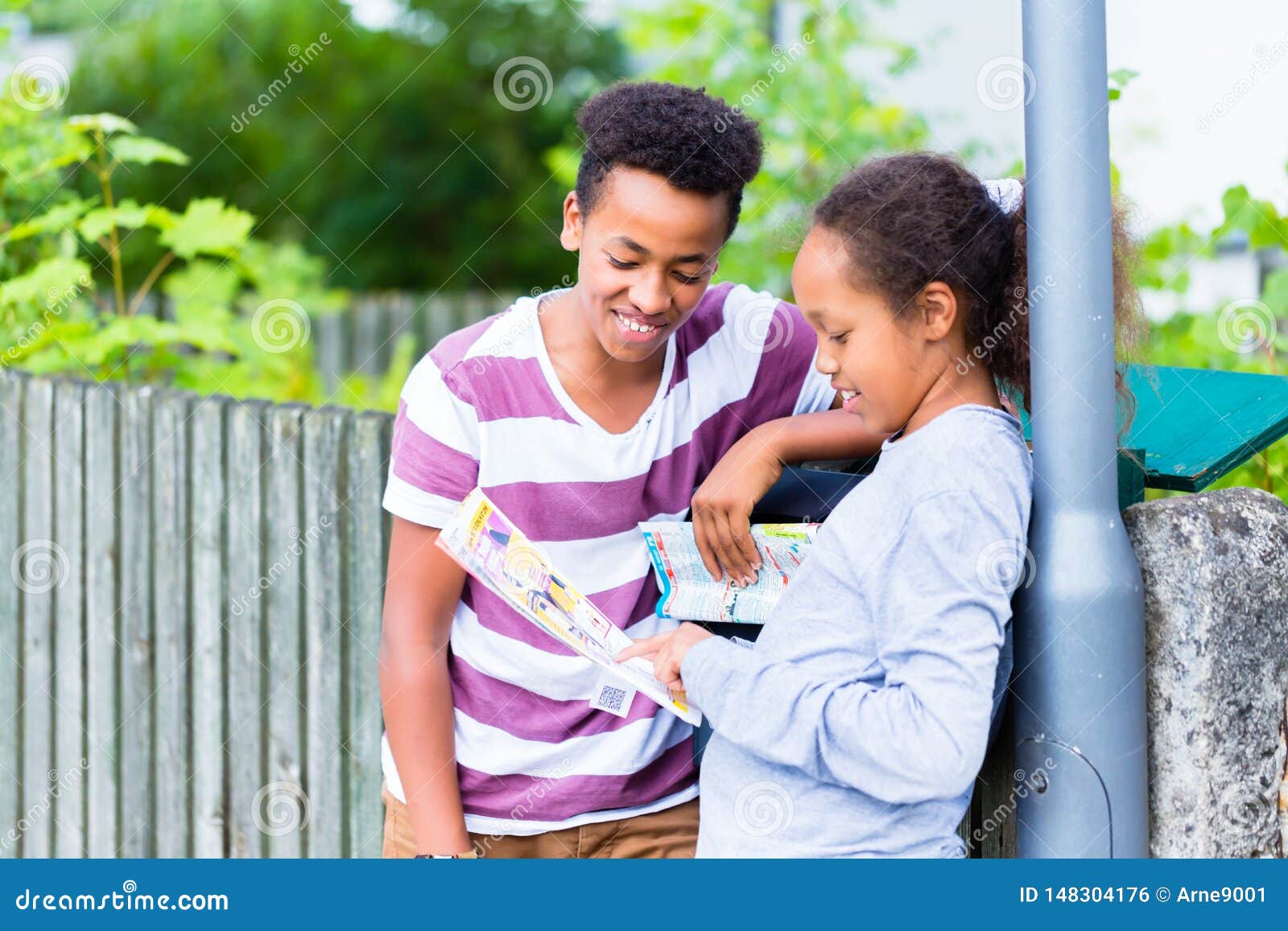 Two kids looking at map stock photo. Image of cartography - 148304176
