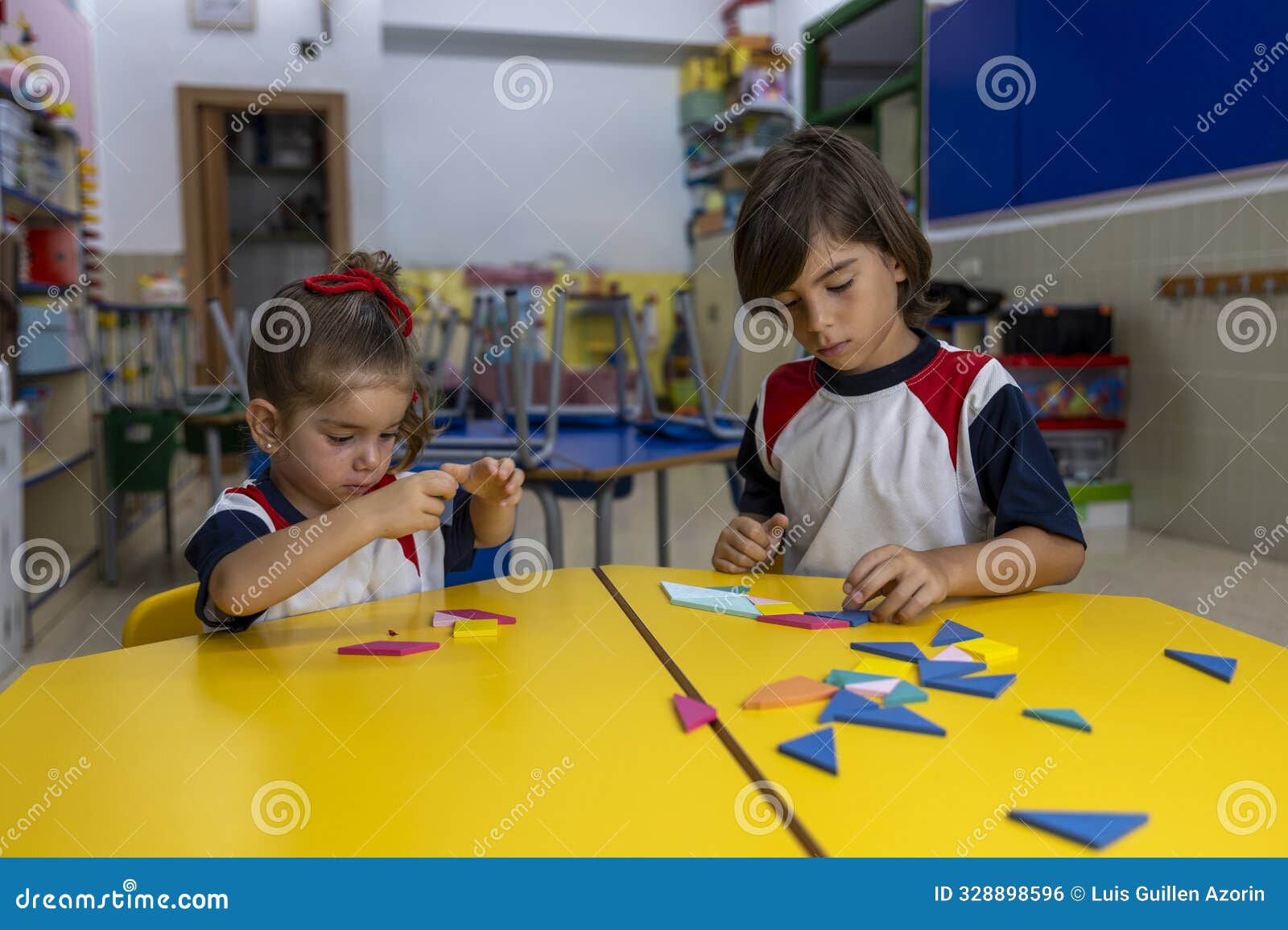 Two Kids Making Puzzles in the School Stock Photo - Image of creative ...