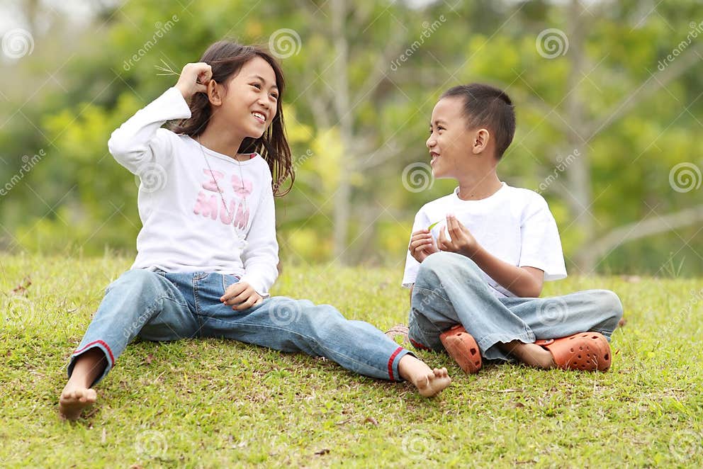 Two Kids Outdoor Having a Chat Stock Photo - Image of friendship ...