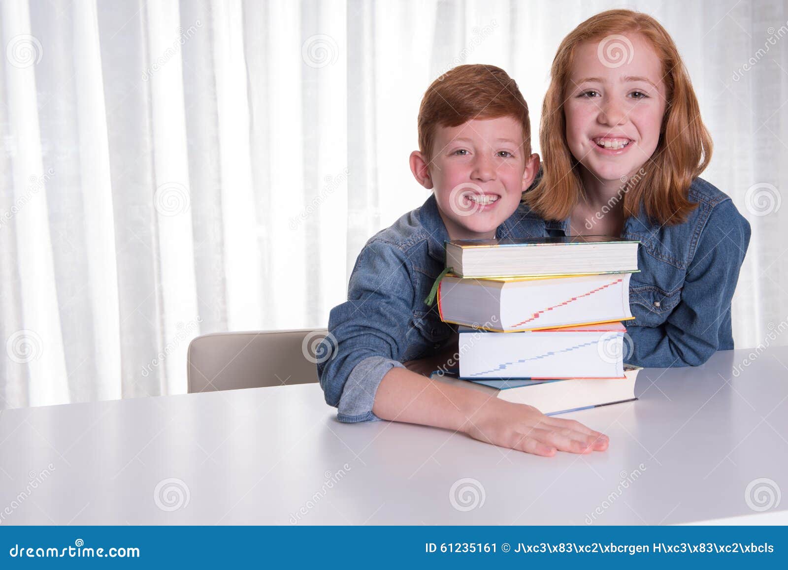 Two Kids and a Pile of Books Stock Image - Image of girl, pencil: 61235161