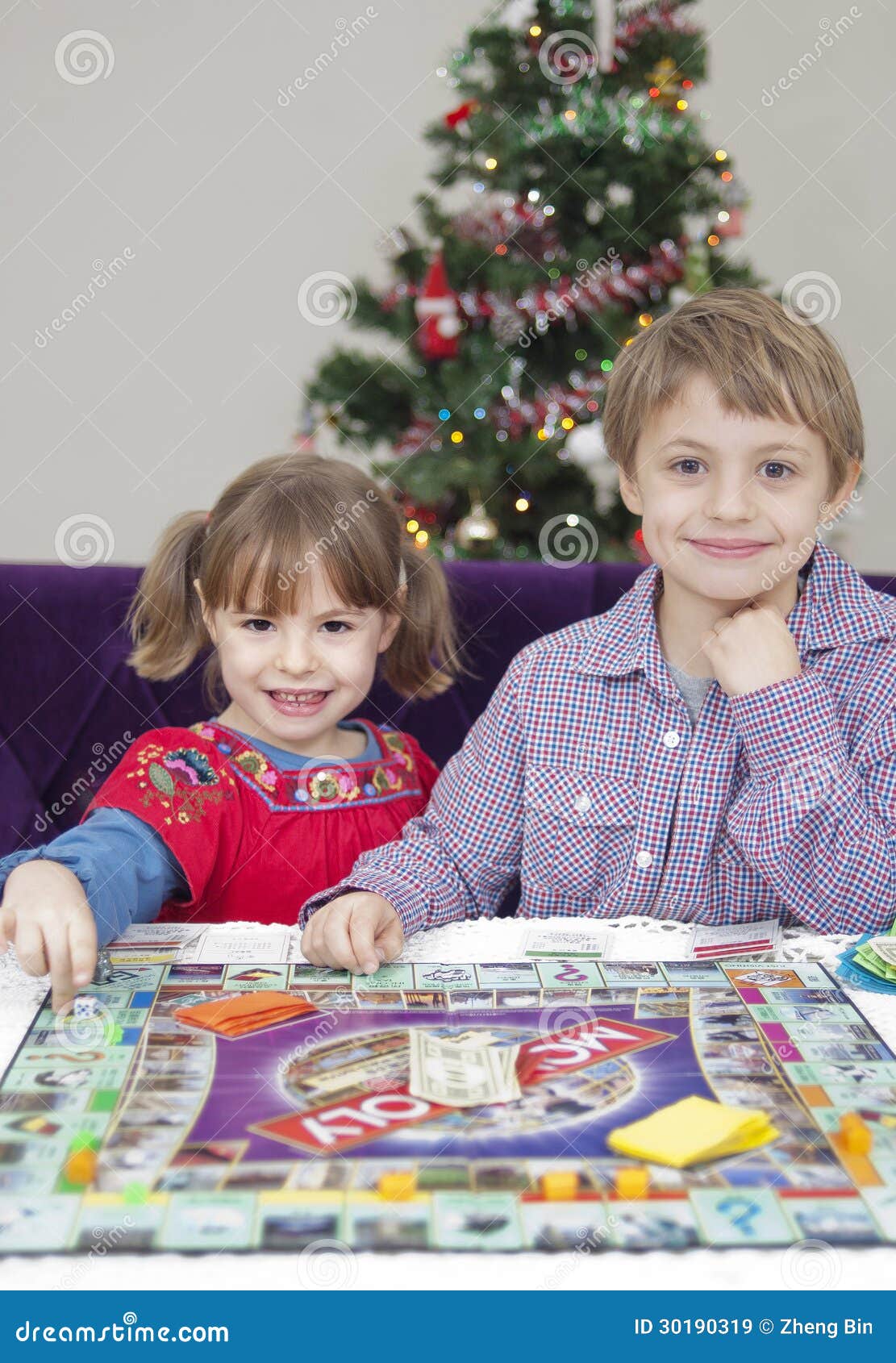 Children play a table game stock image. Image of card - 30190319