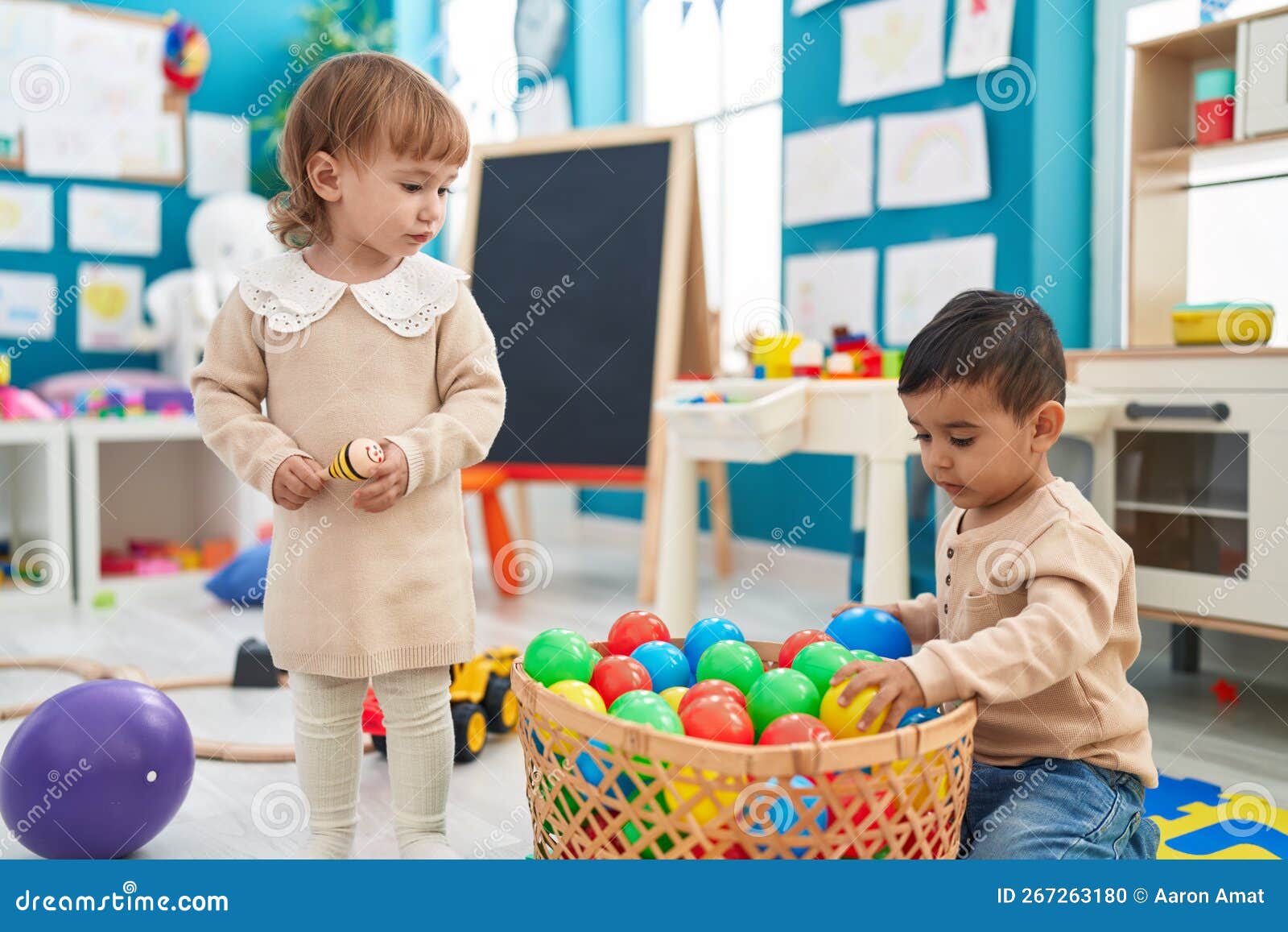 Two Kids Playing with Balls Standing at Kindergarten Stock Photo ...
