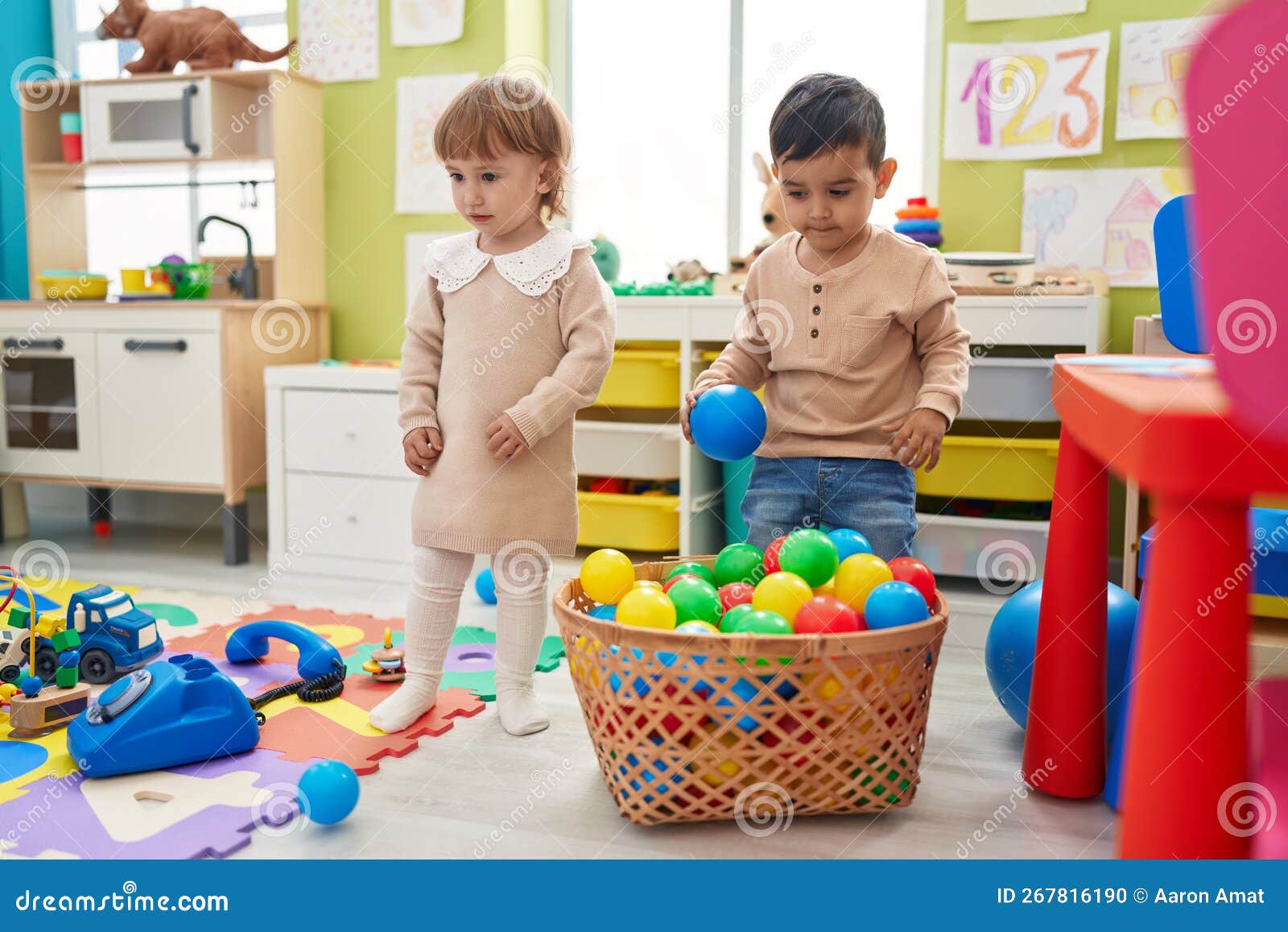 Two Kids Playing with Balls Standing at Kindergarten Stock Photo ...
