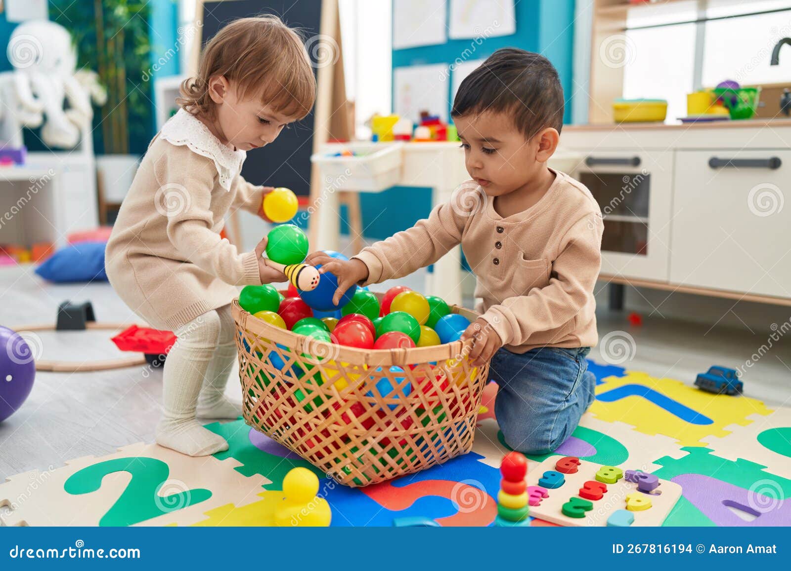 Two Kids Playing with Balls Standing at Kindergarten Stock Photo ...