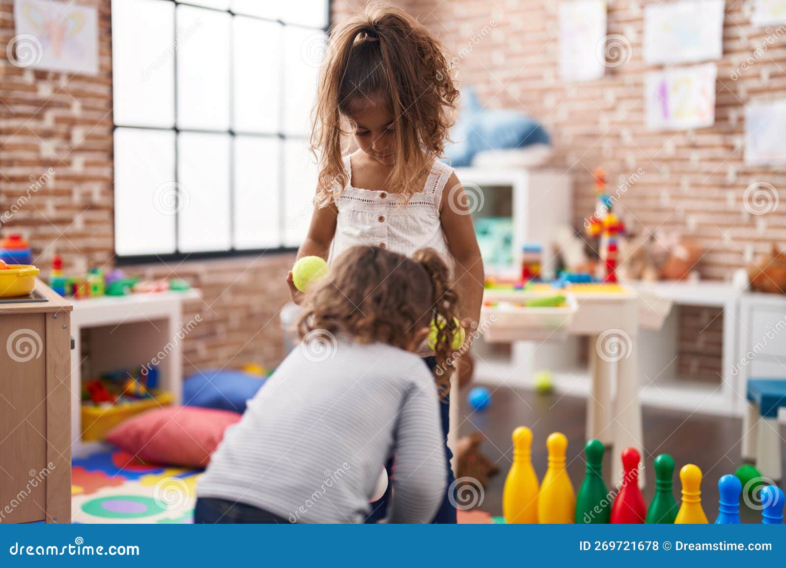 Two Kids Playing Bowling at Kindergarten Stock Photo - Image of serious ...